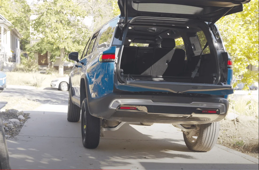 Rivian compact spare inflated & installed in glowing R1S review video ...