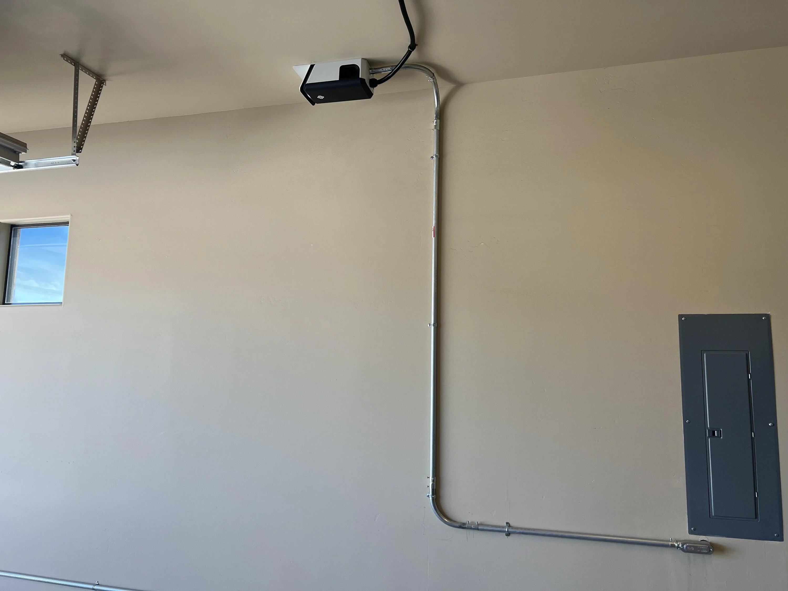 Ceiling mounted Rivian wall charger with drop down cord | Rivian Forum ...