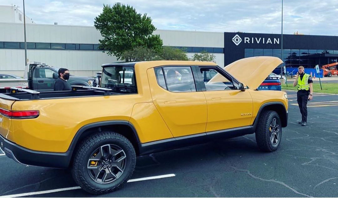 Yellow and Blue R1T promotional shoot with Normal Police | Rivian Forum ...