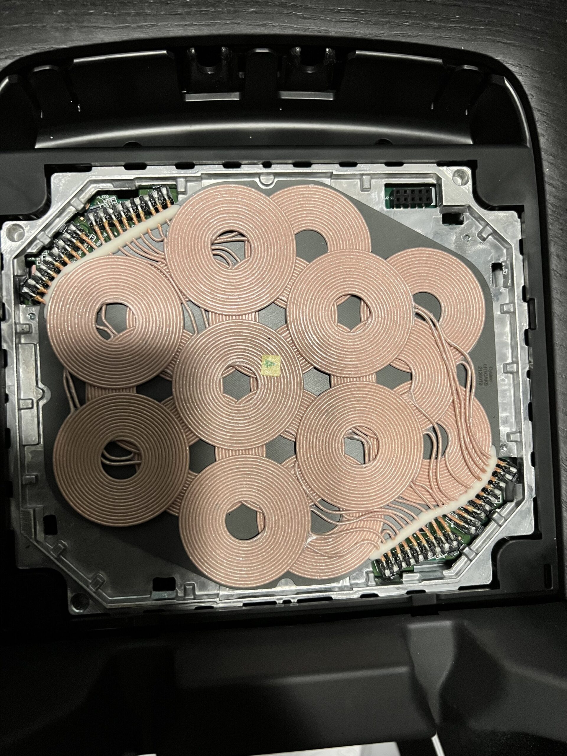 Here's a look at the wireless charger coils on the center console ...