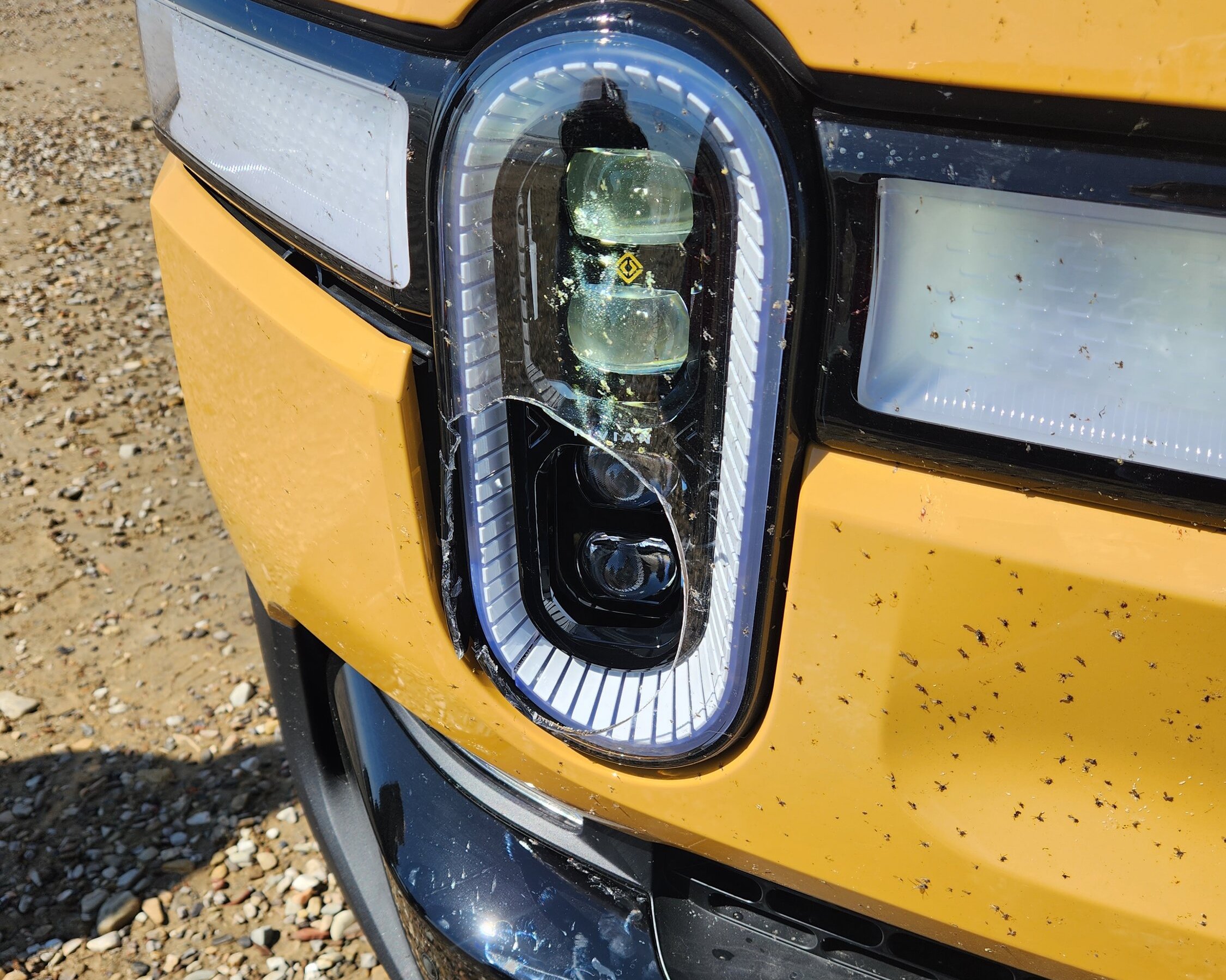 One-eyed R1T :( Headlight broken by a Jeep | Rivian Forum - R1T R1S R2 ...