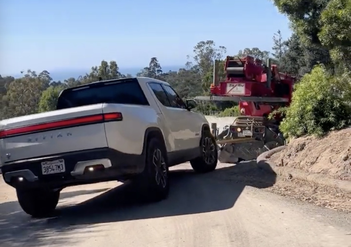 Rivian R1T pulls out a stuck crane truck 🦾 | Rivian Forum - R1T R1S R2 ...